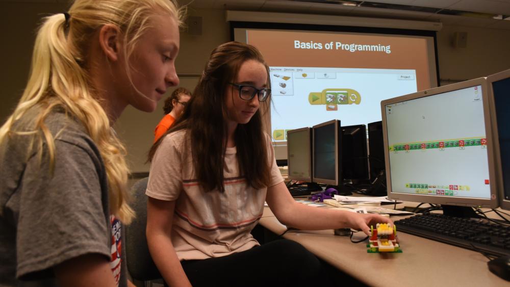 Middle school girls program Lego robots during GE Girls camp | Penn ...