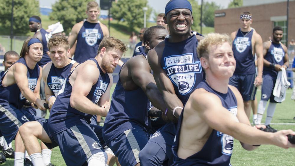 Football team goes long on community service, lending 1,900 hours in ...