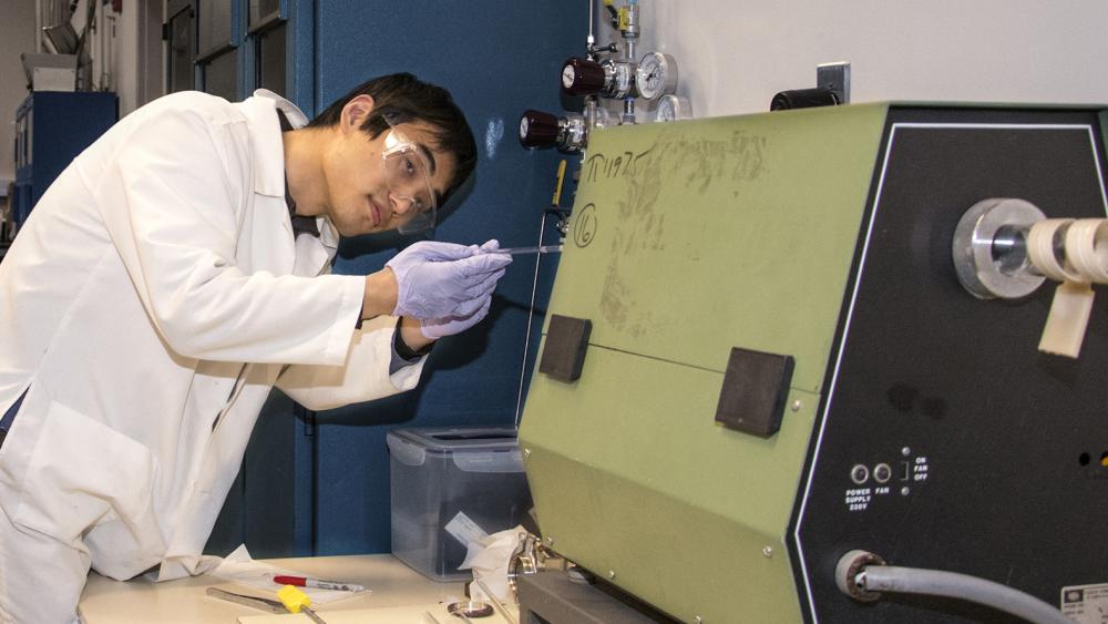 Material scientist exploring ways to improve efficiency of solar cells ...