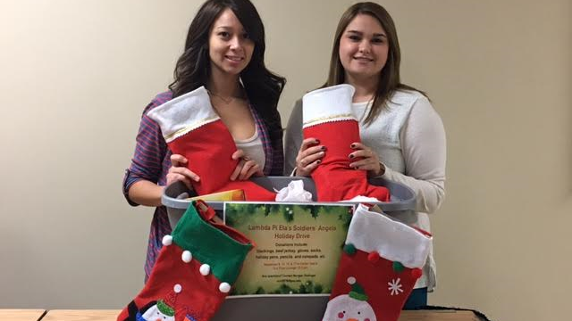 Lambda Pi Eta honor society donates holiday stockings to Soldiers ...